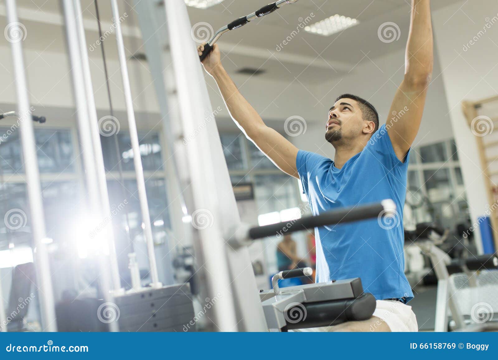 Young man training in gym stock image. Image of person - 66158769