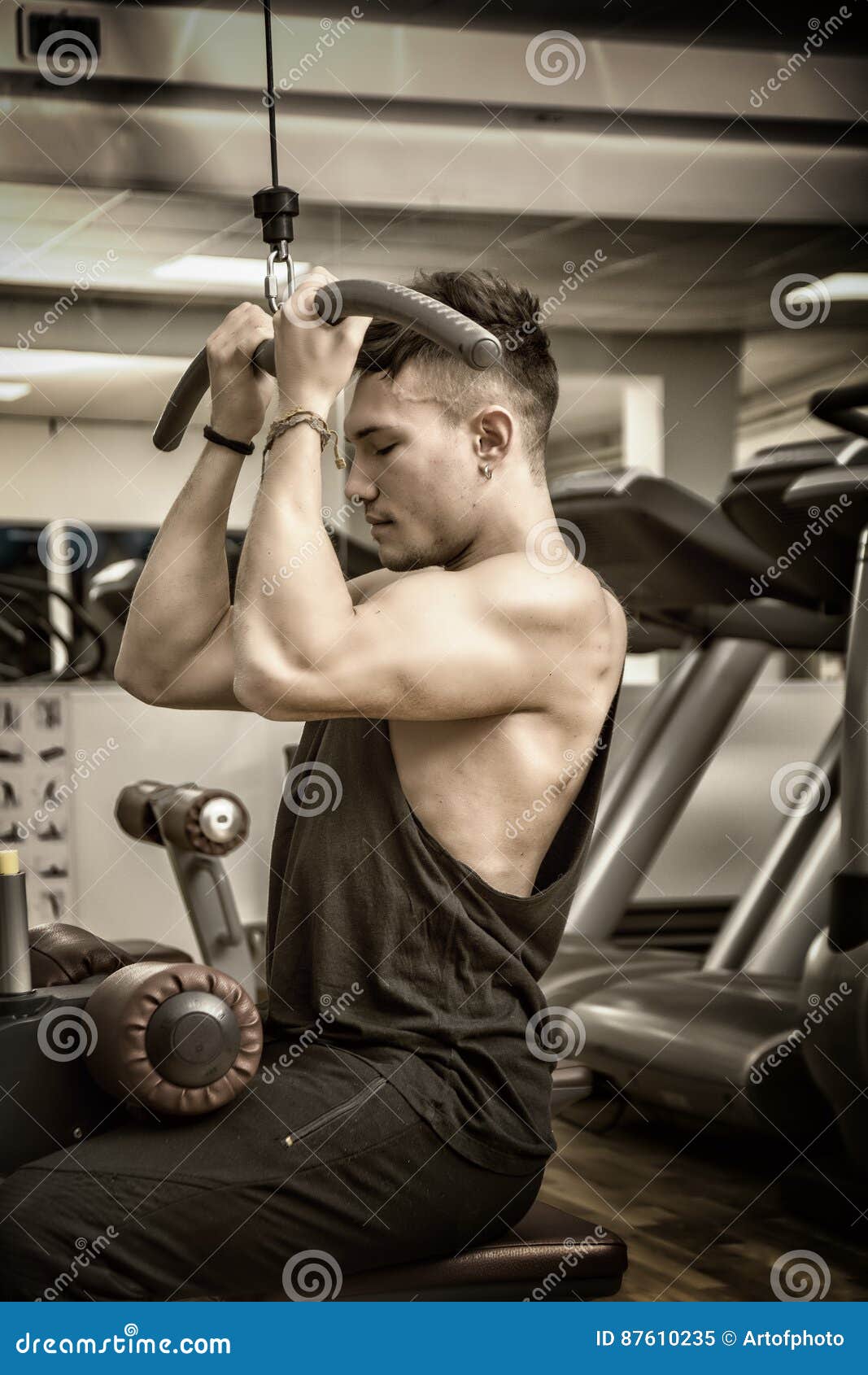 Young Man Training on Gym Equipment Stock Image - Image of person ...