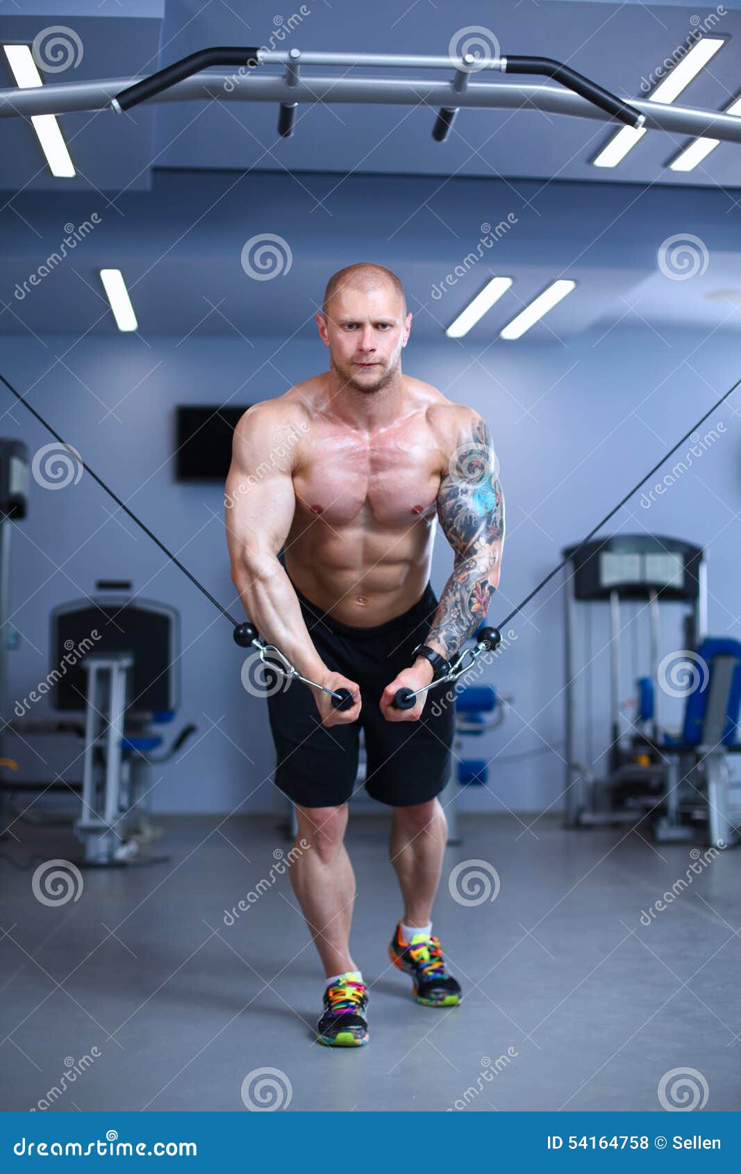Young Man Training at Gym with Exercises Stock Photo - Image of ...