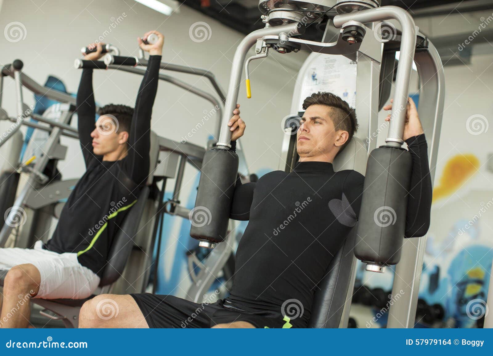 Young Man Training in the Gym Stock Photo - Image of slim, athlete ...