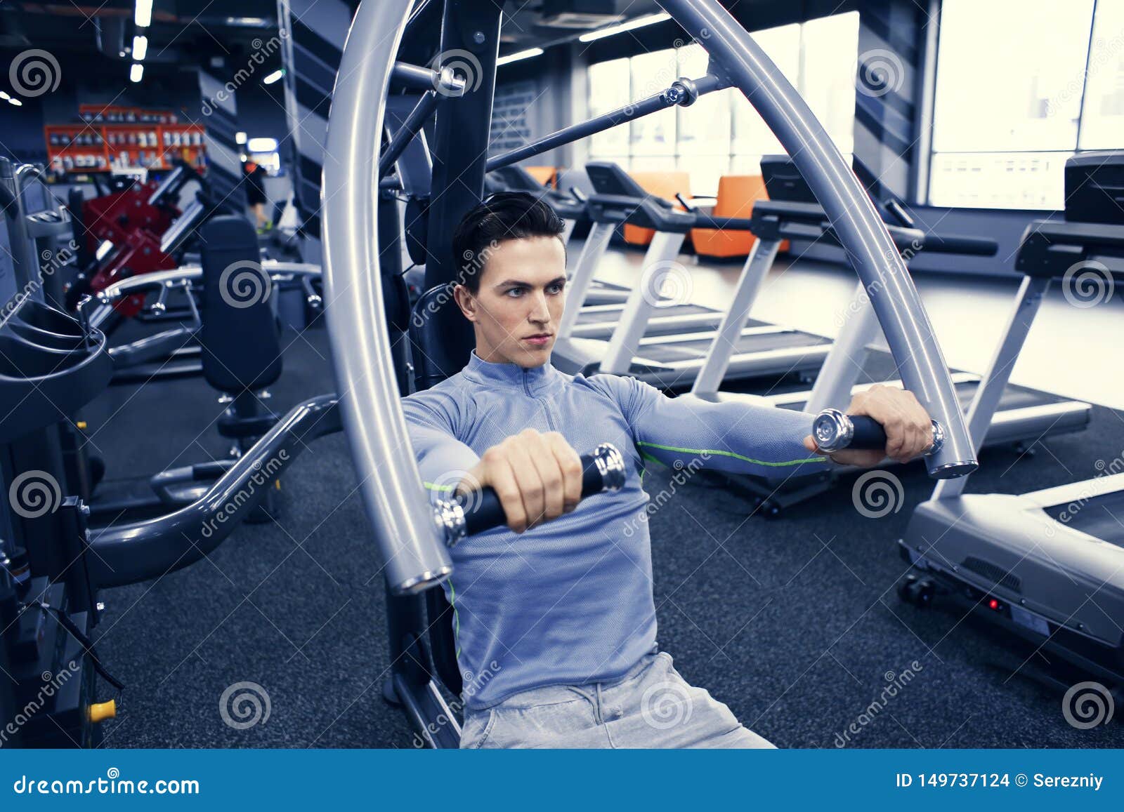 Young Man Training in Modern Gym Stock Photo - Image of body, activity ...