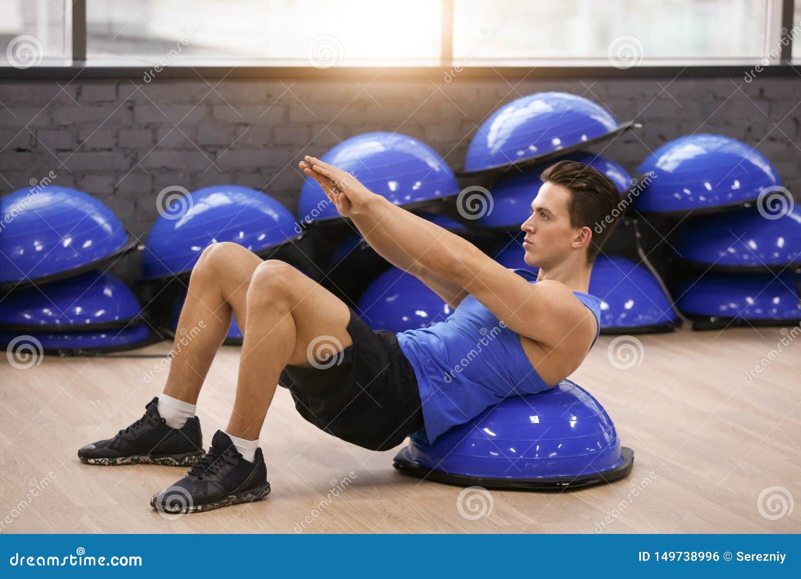 Young Man Training in Modern Gym Stock Photo - Image of hobby, health ...