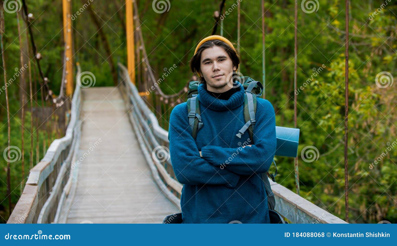 Young Man Traveler Standing on the Bridge and Looking in the Camera ...
