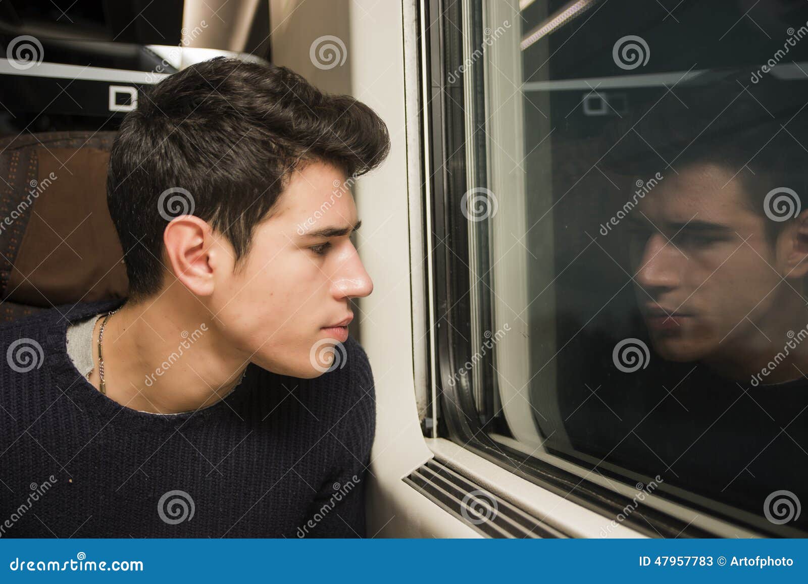 Young Man Travelling in Train Looking Out of Window Stock Image - Image ...