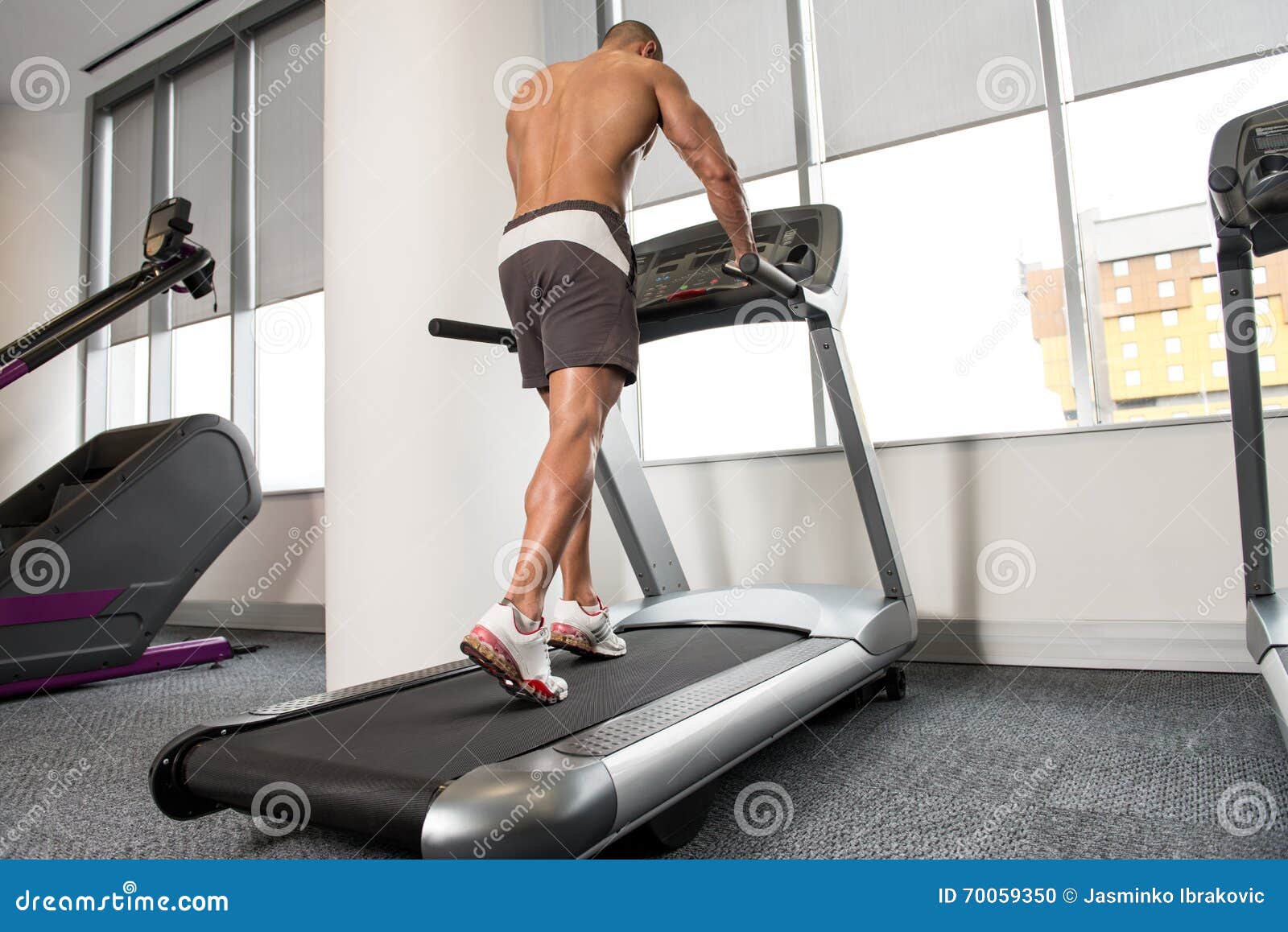 Young Man on Treadmill Back View Stock Photo - Image of determination ...