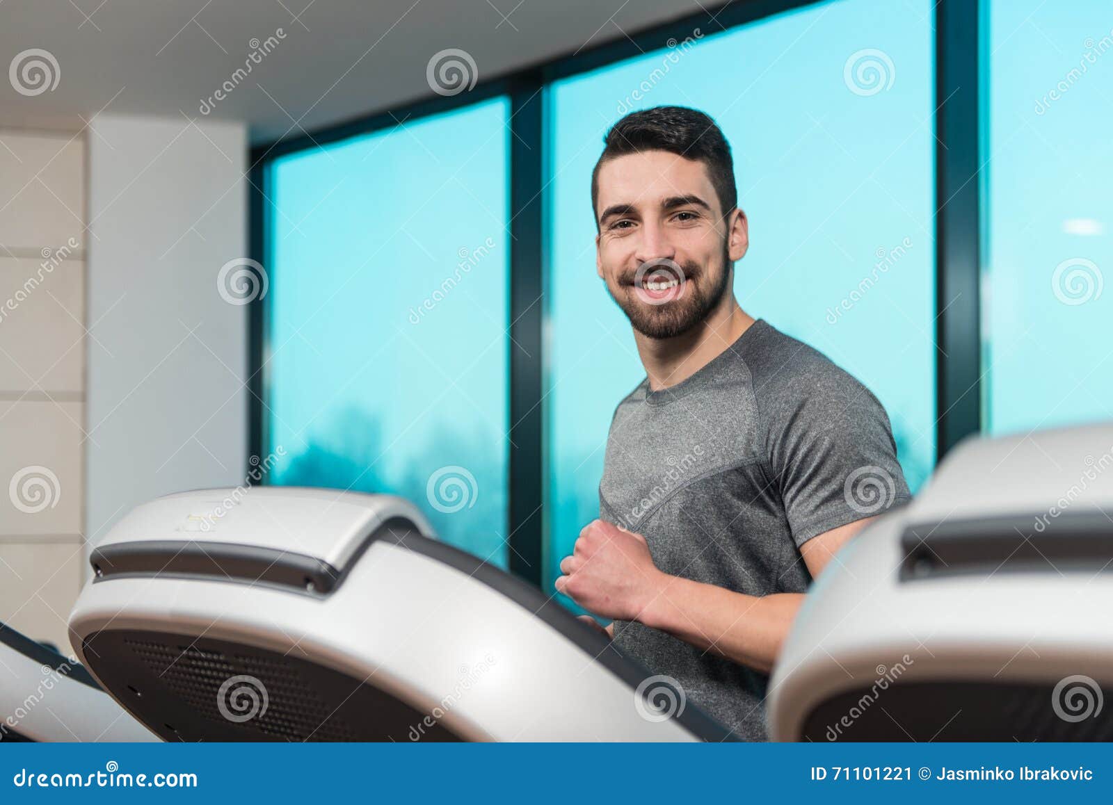 Young Man on Treadmill stock image. Image of exercise - 71101221
