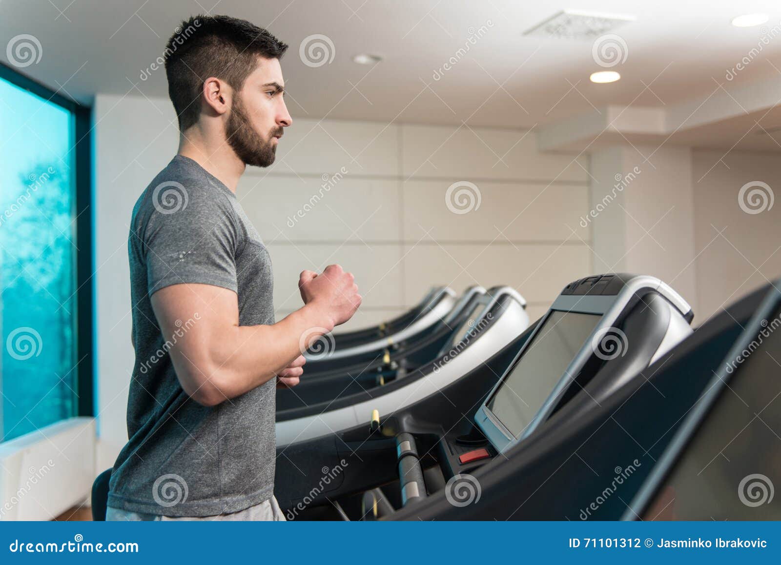 Young Man on Treadmill stock photo. Image of legs, fitness - 71101312