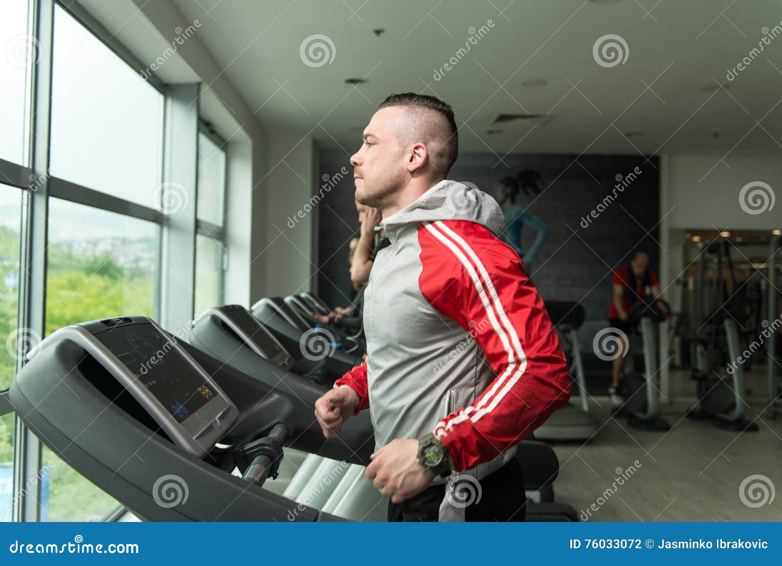 Young Man on Treadmill stock photo. Image of runners - 76033072