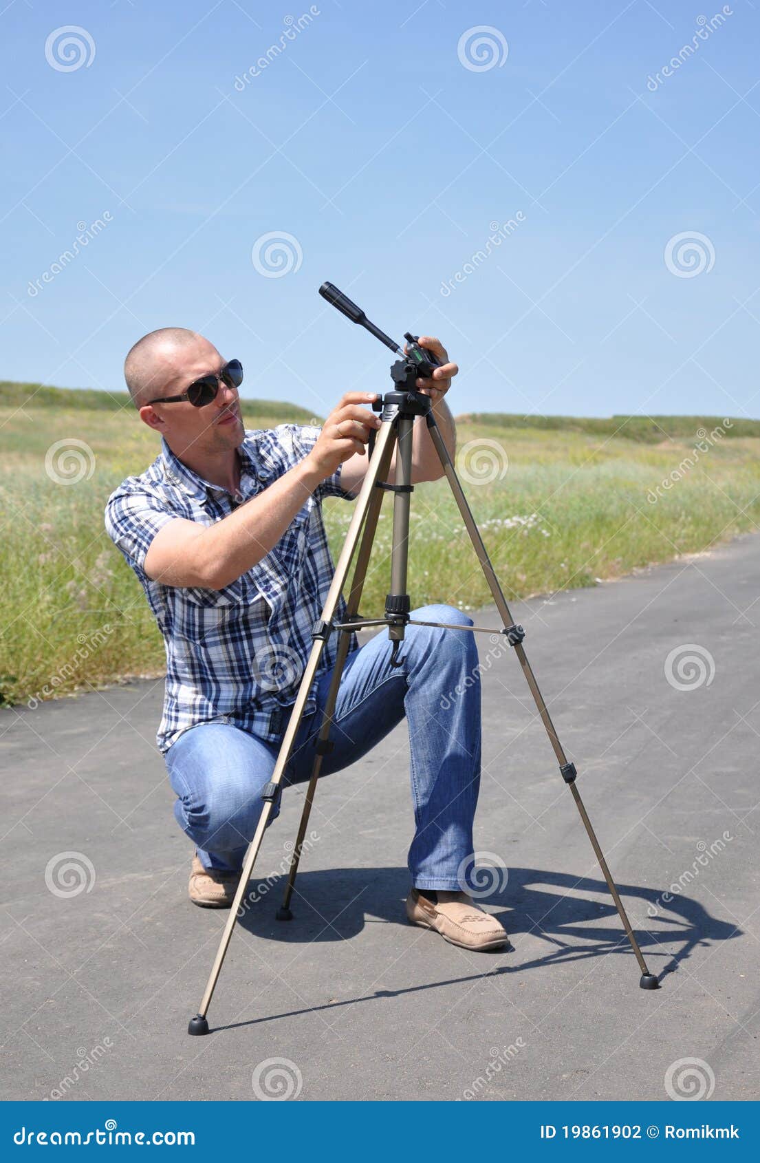 Young man with tripod stock photo. Image of male, professional - 19861902
