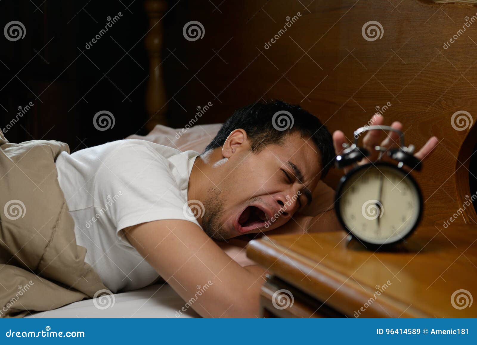 Young Man Turning Off the Alarm Clock Stock Image - Image of hand, time ...