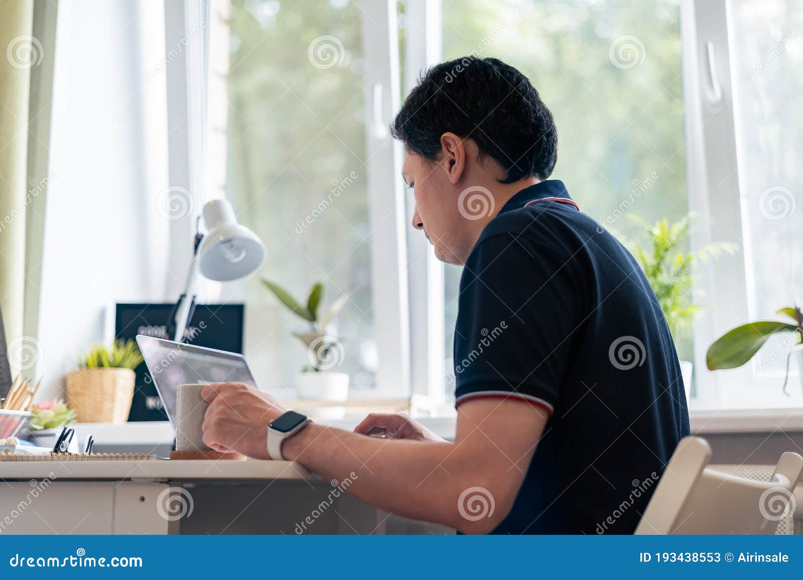 The Young Man Typing Email on Laptop Computer while Sitting at Home ...