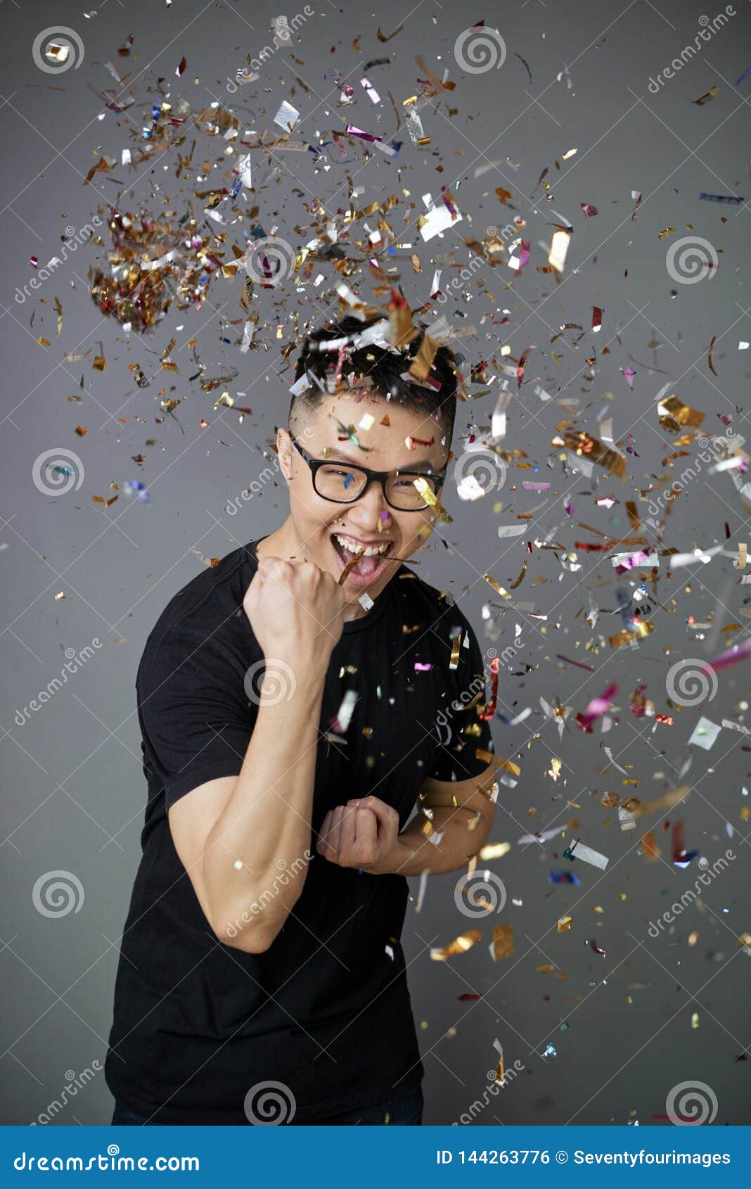Young Man Under Falling Confetti Stock Photo - Image of vietnamese ...