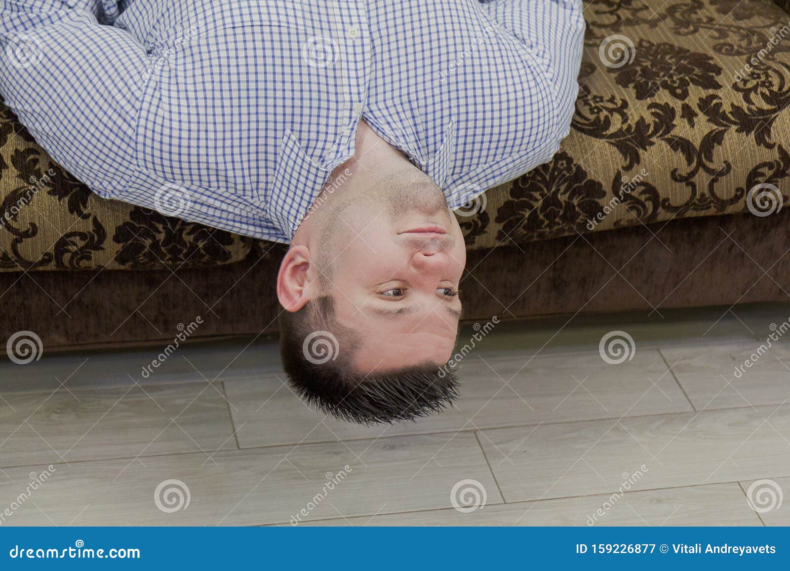 Young Man Upside Down on a Couch. Stock Image - Image of jeans, emotion ... Young Man Upside Down on a Couch. Stock Image - Image of jeans, emotion ...