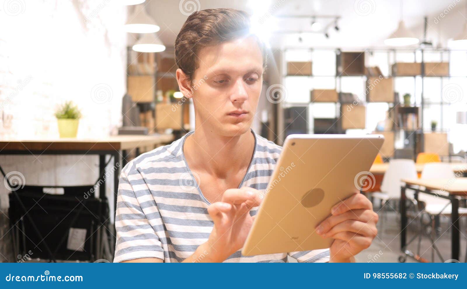 Young Man Using Applications on Tablet Computer, Portrait Stock Photo ...