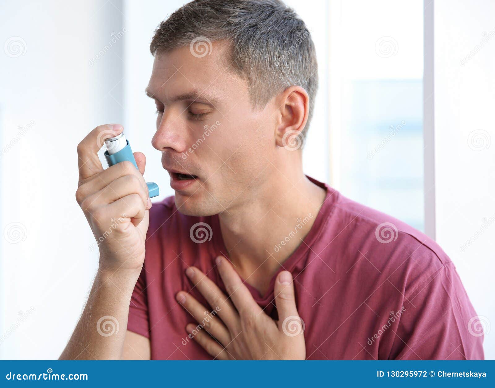 Young Man Using Asthma Inhaler Stock Photo - Image of drug, inhalation ...