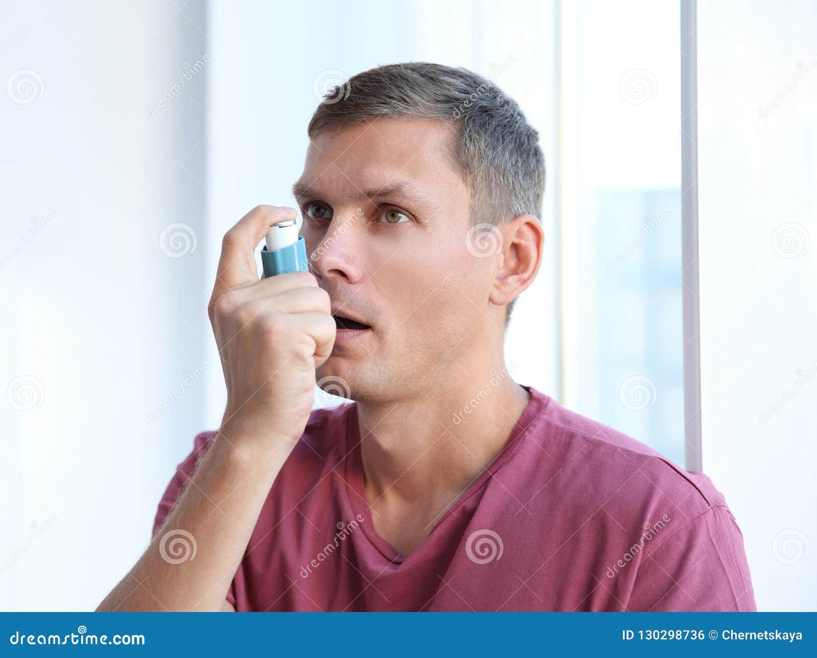 Young Man Using Asthma Inhaler Stock Photo - Image of breath, home ...