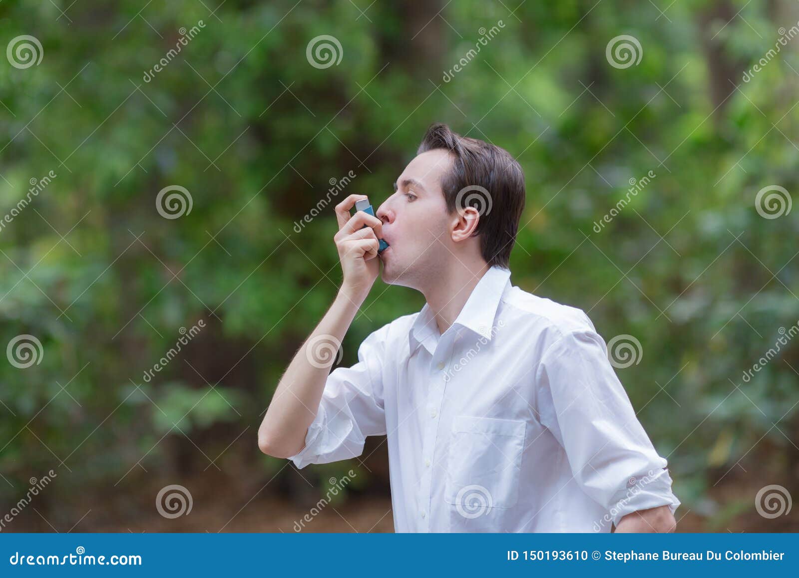 Young Man is Using a Asthma Inhaler Stock Photo - Image of aerosol ...