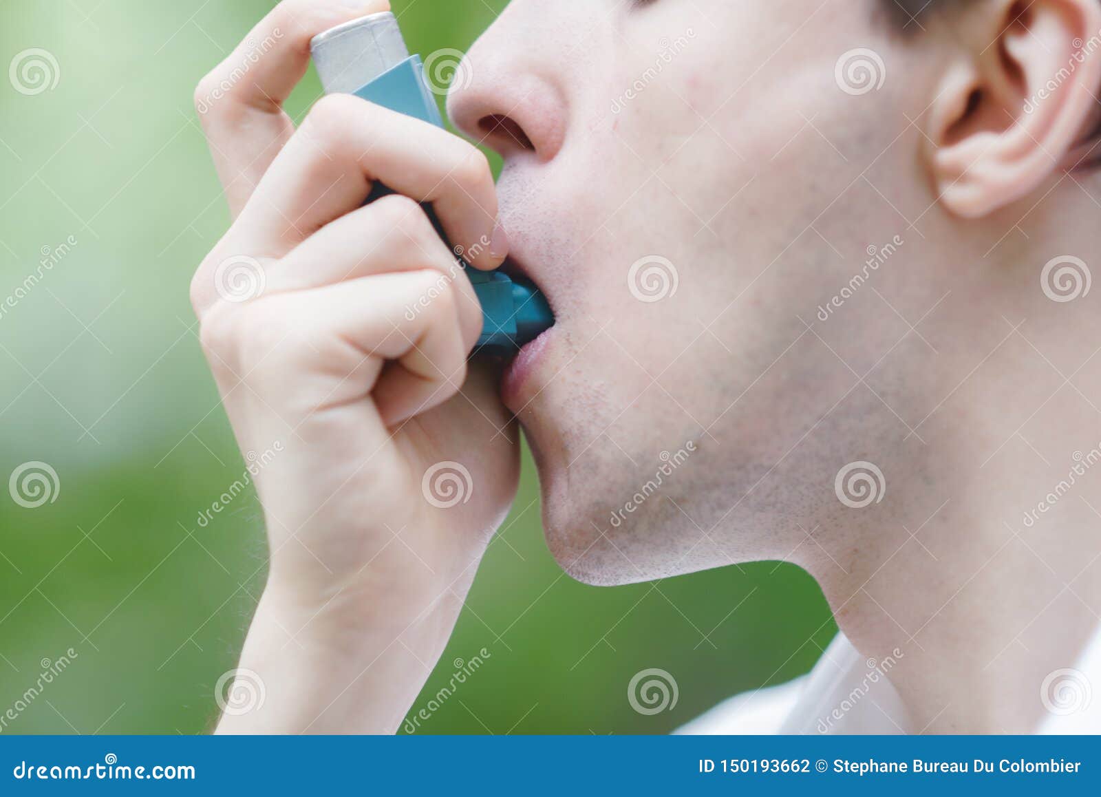 Young Man is Using a Asthma Inhaler Stock Photo - Image of japan ...