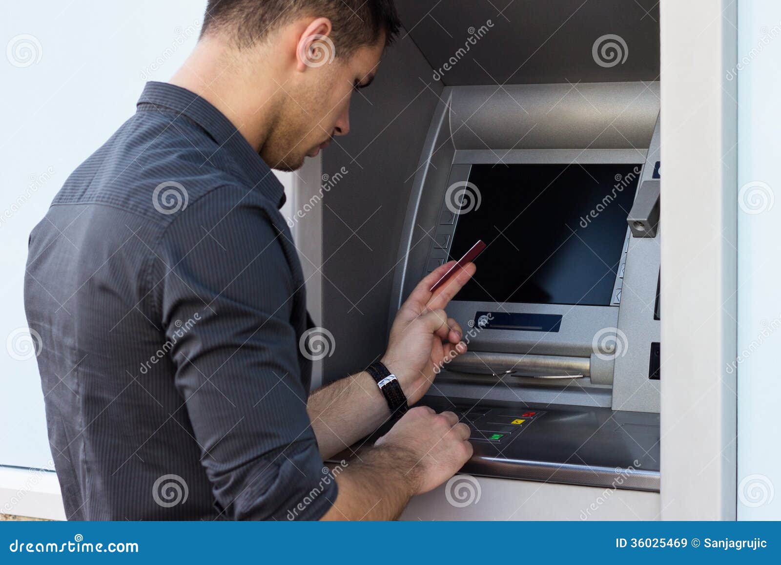 Young man using ATM stock image. Image of removing, card - 36025469