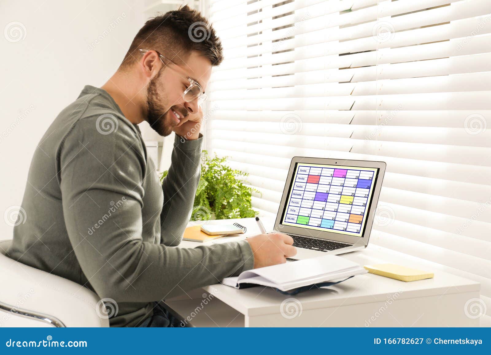 Young Man Using Calendar App on Laptop Stock Image - Image of business ...