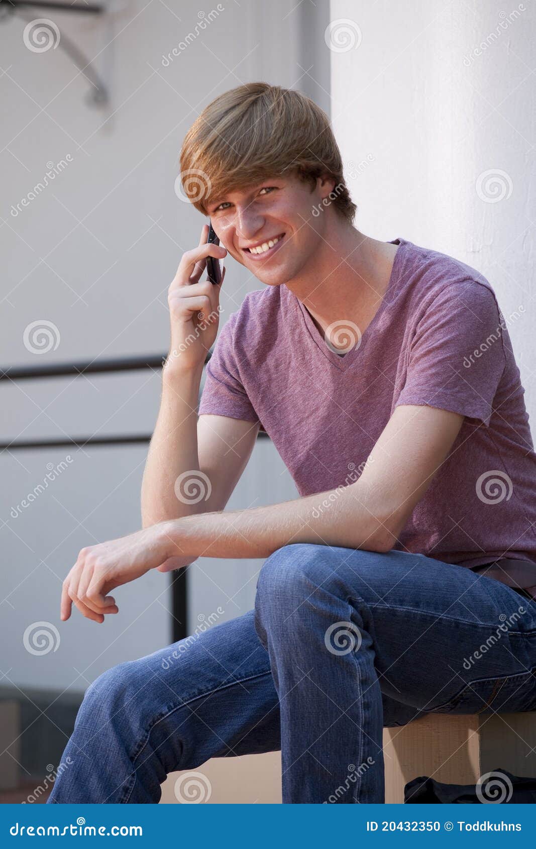 Young Man Using a Cell Phone Stock Photo - Image of cell, outside: 20432350