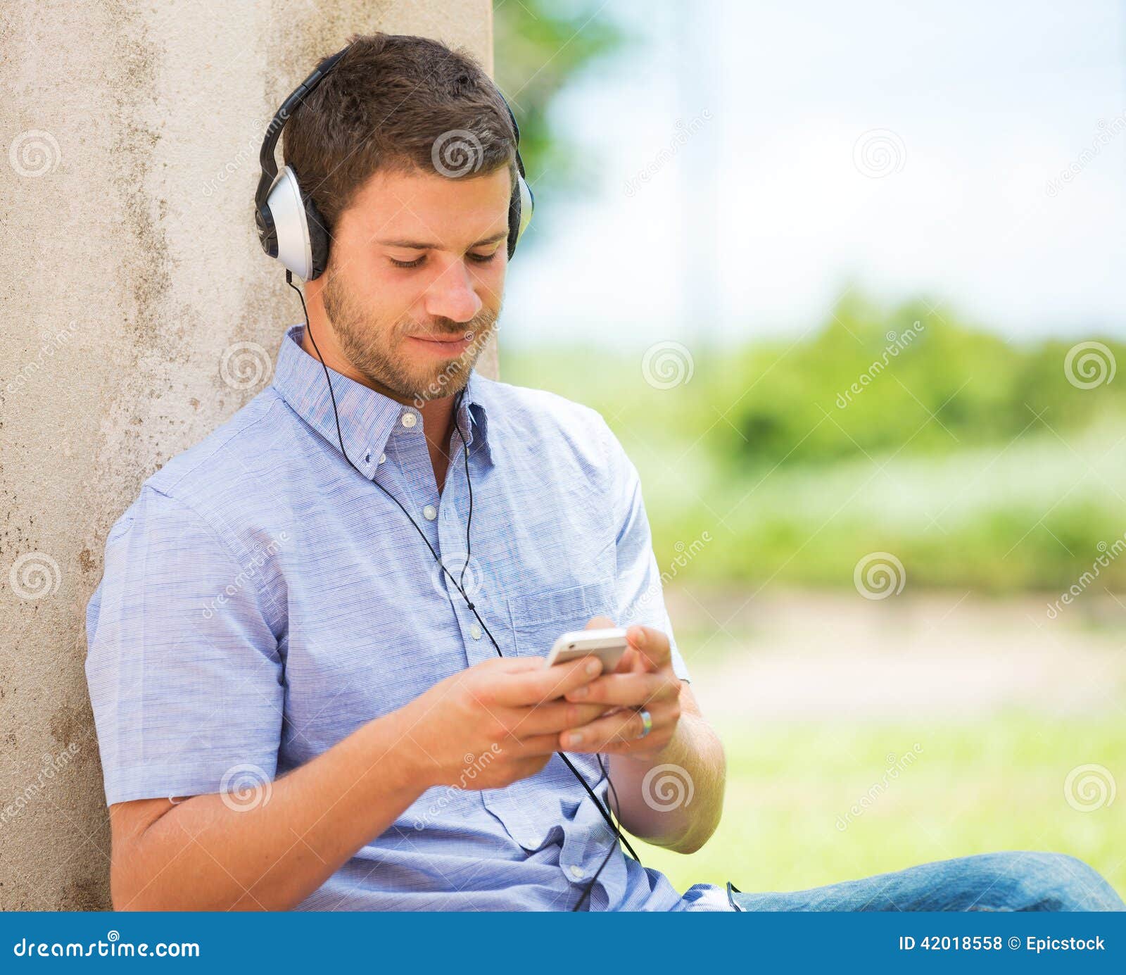 Young man using cell phone stock photo. Image of smart - 42018558