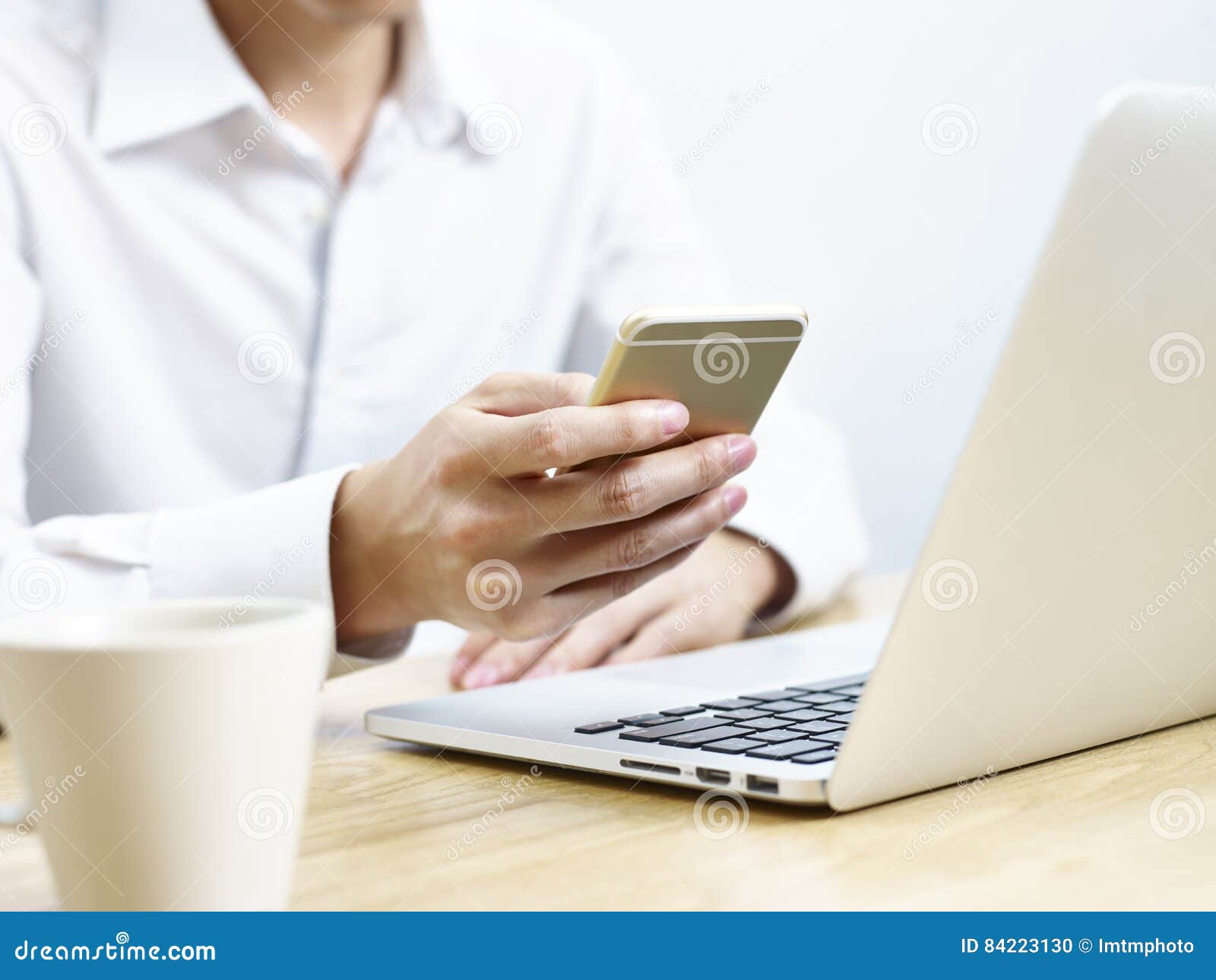 Young Man Using Cellphone and Laptop Stock Photo - Image of people ...