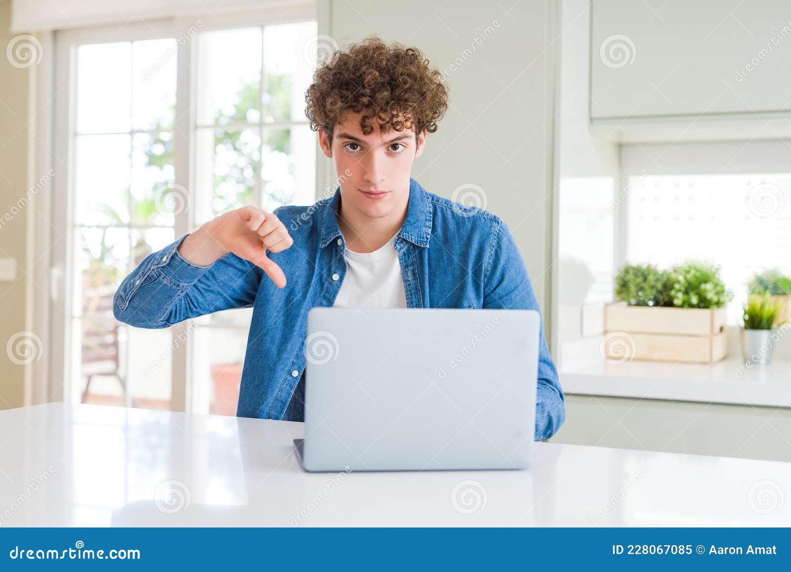 Young Man Using Computer Laptop with Angry Face, Negative Sign Showing ...