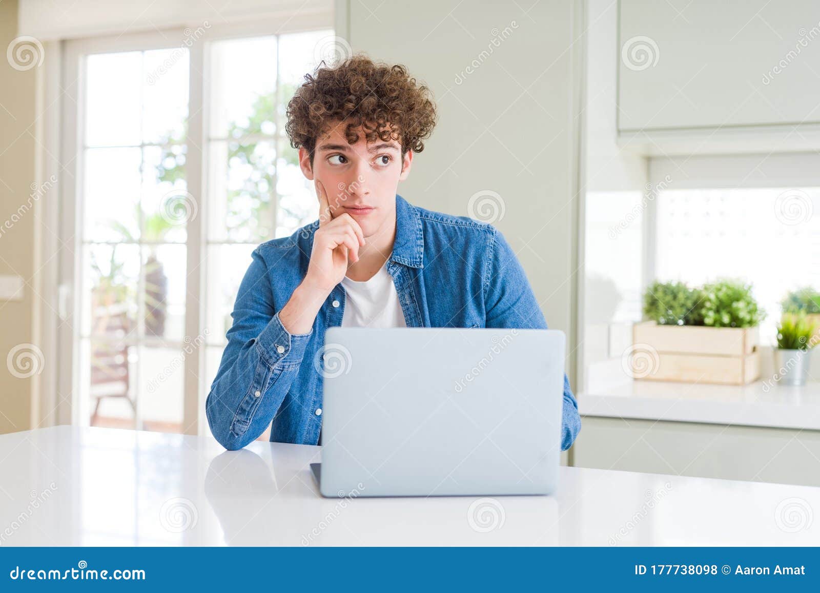 Young Man Using Computer Laptop Serious Face Thinking about Question ...