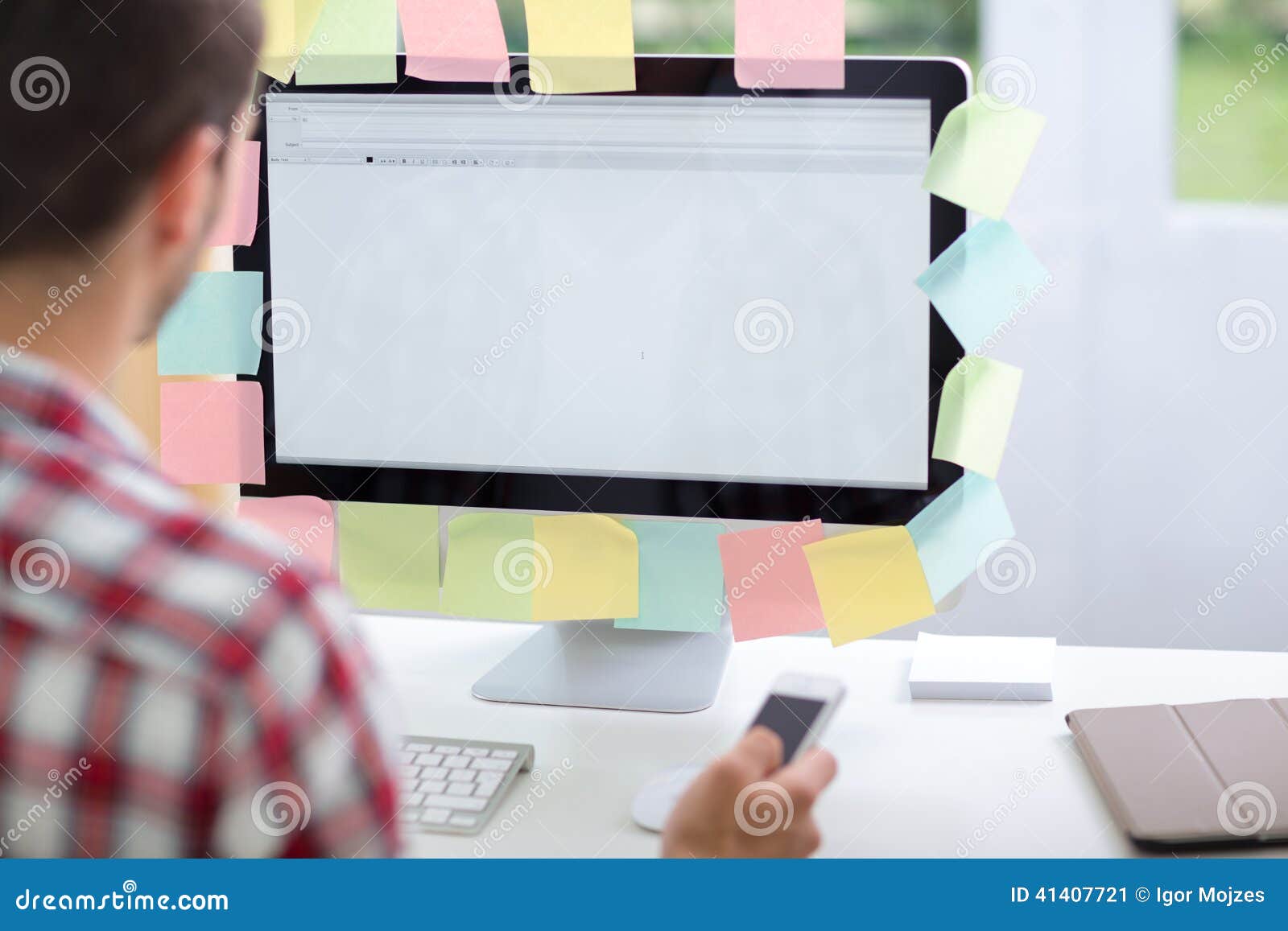 Young Man Using Computer with Notes on it Stock Image - Image of ...