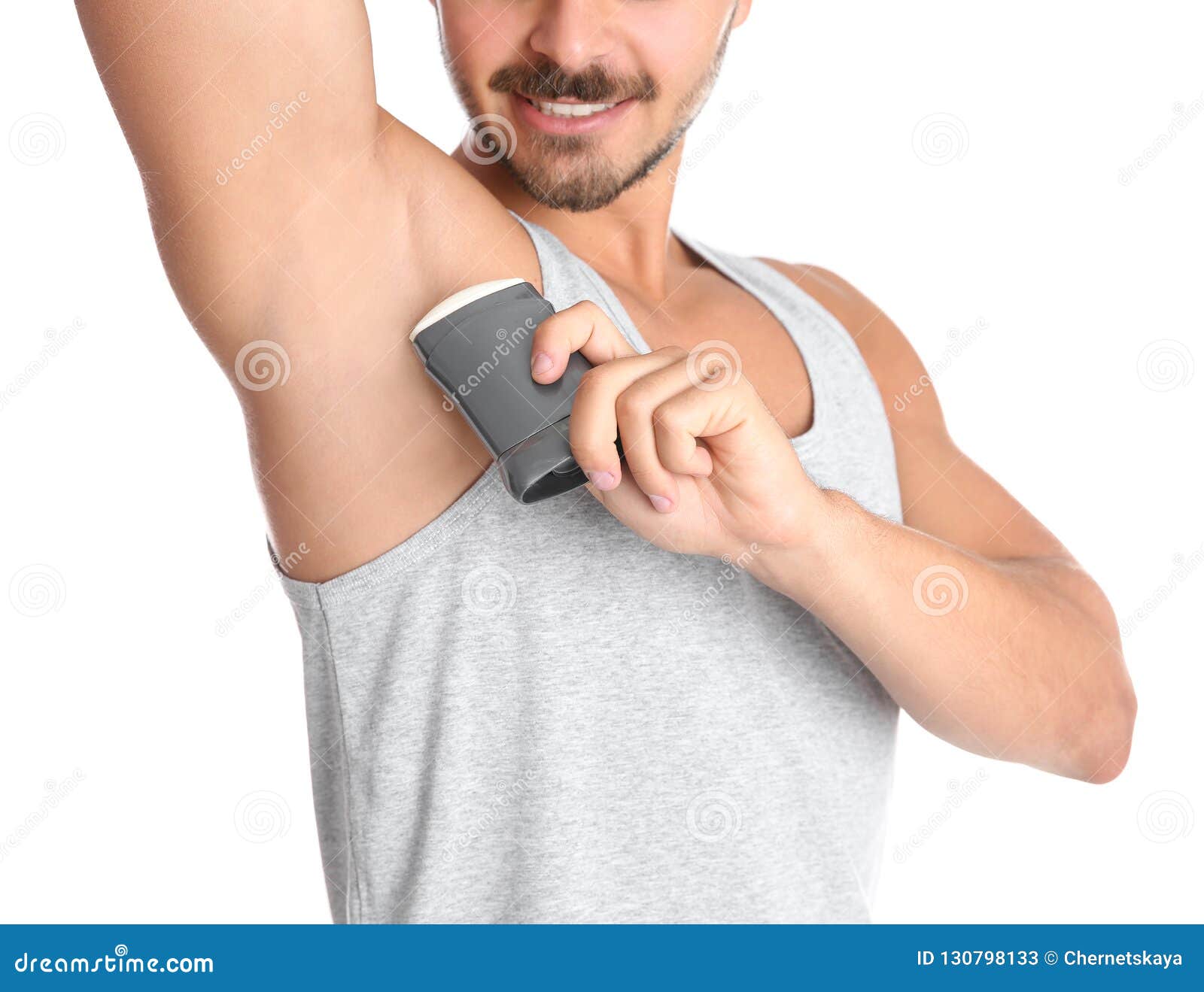 Young Man Using Deodorant on White Background Stock Image - Image of ...
