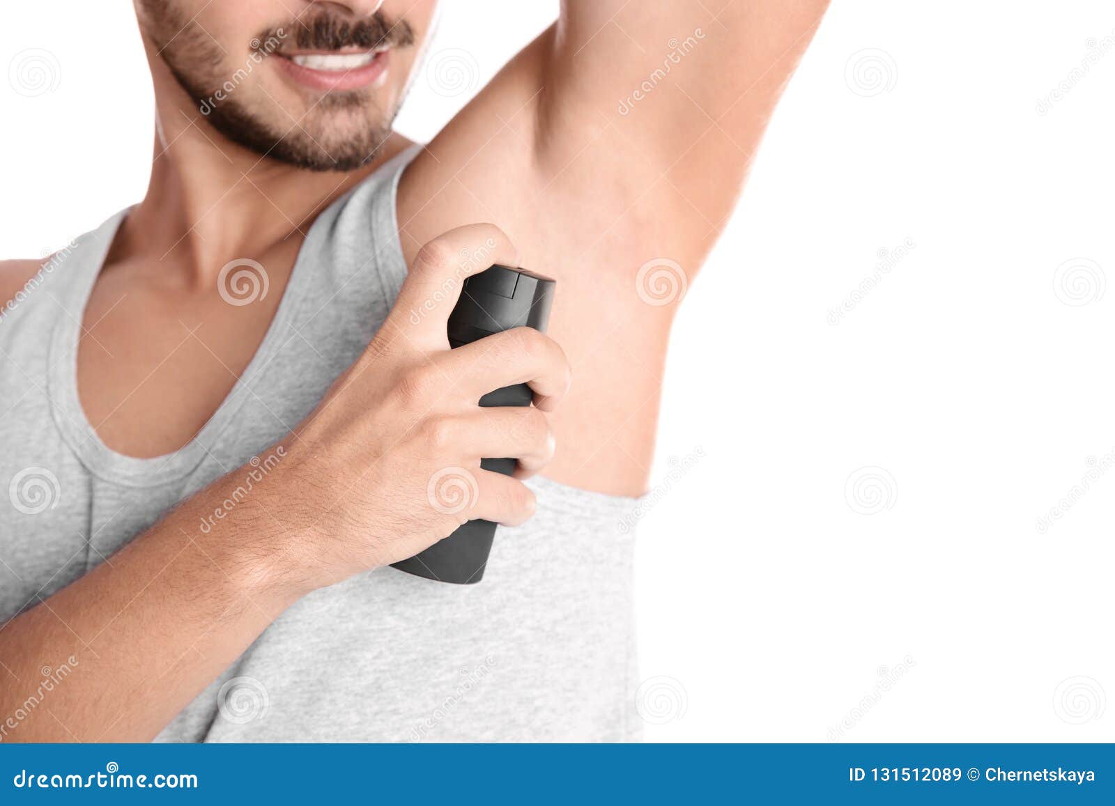 Young Man Using Deodorant on White Background Stock Image - Image of ...