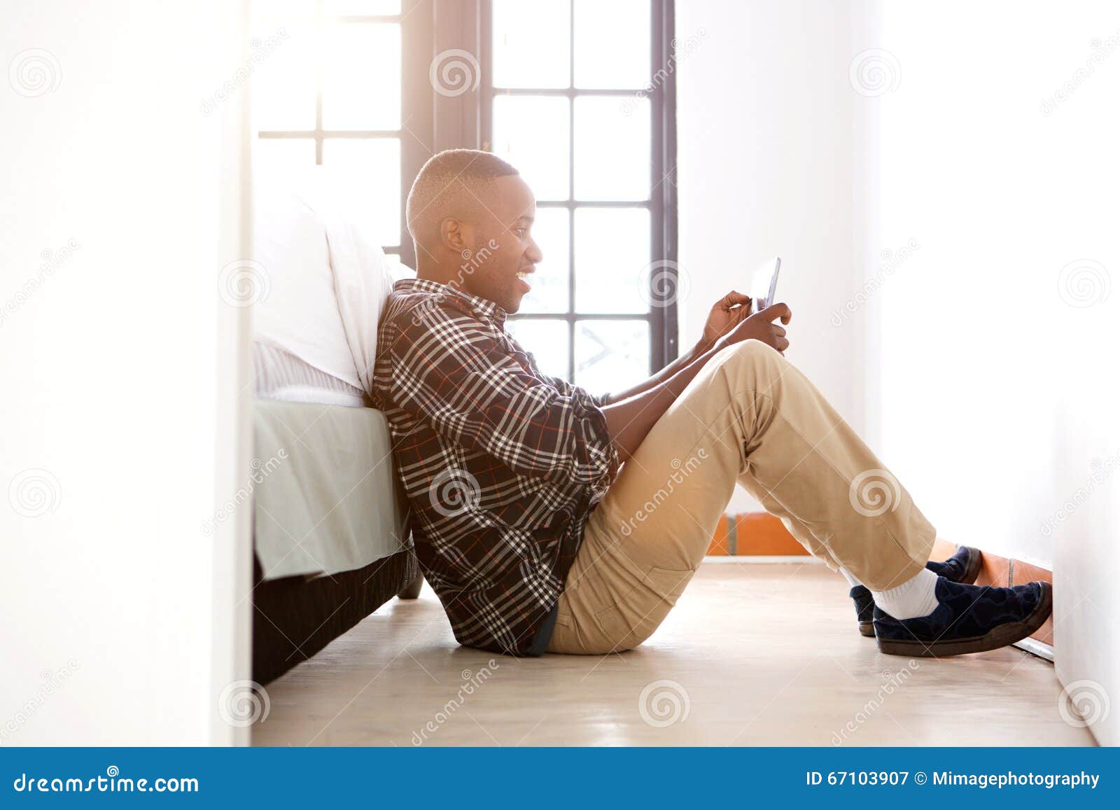 Young Man Using Digital Tablet at Home Stock Image - Image of cheerful ...