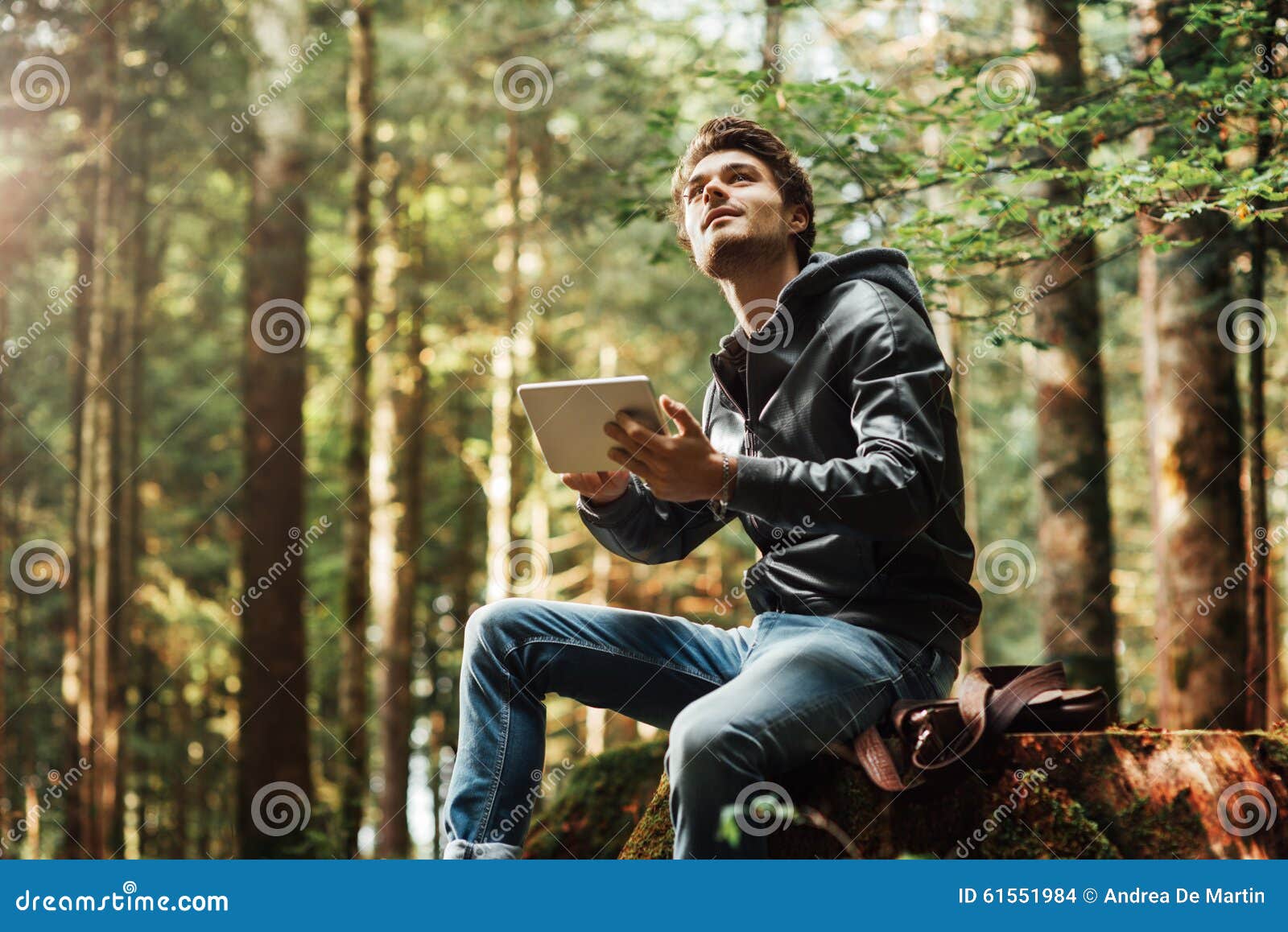 Young Man Using a Digital Tablet in the Woods Stock Photo - Image of ...