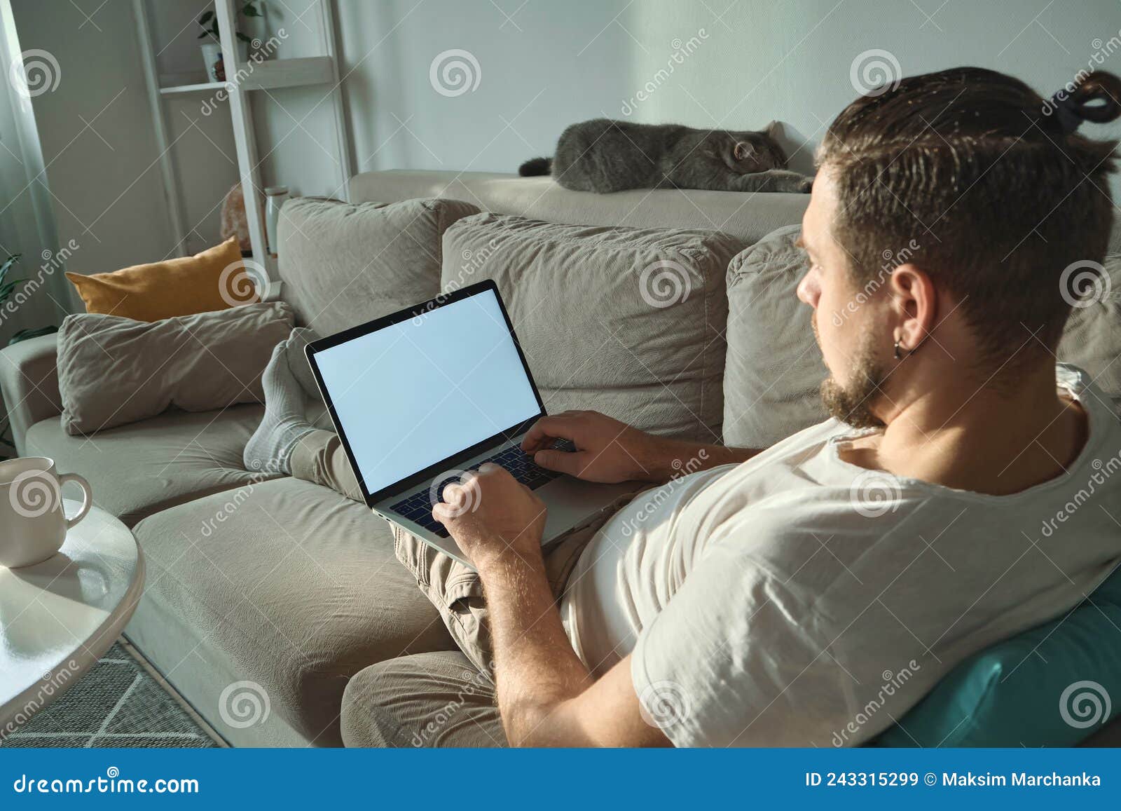 Young Man Using Empty Blank Screen Laptop Typing and Working Lying on ...