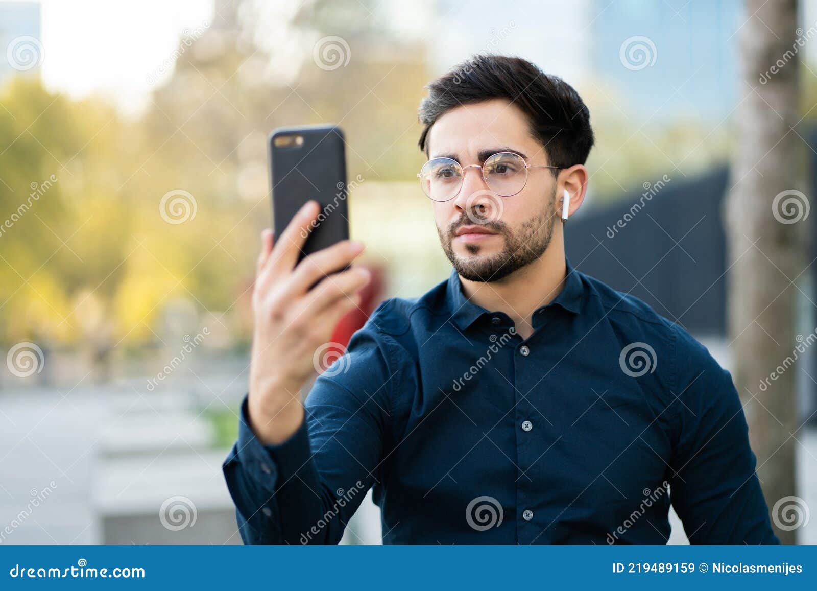 Young Man Using Face Id for Unlock Mobile Phone Outdoors. Stock Image ...