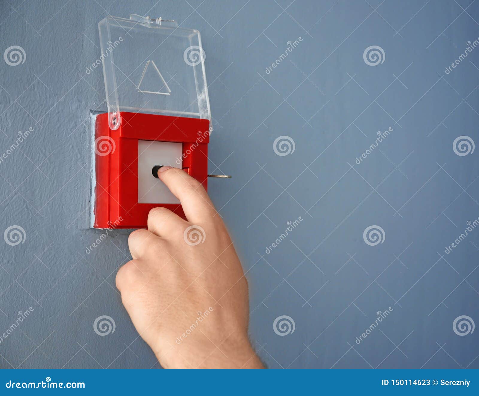 Young Man Using Fire Alarm System Indoors Stock Image - Image of ...