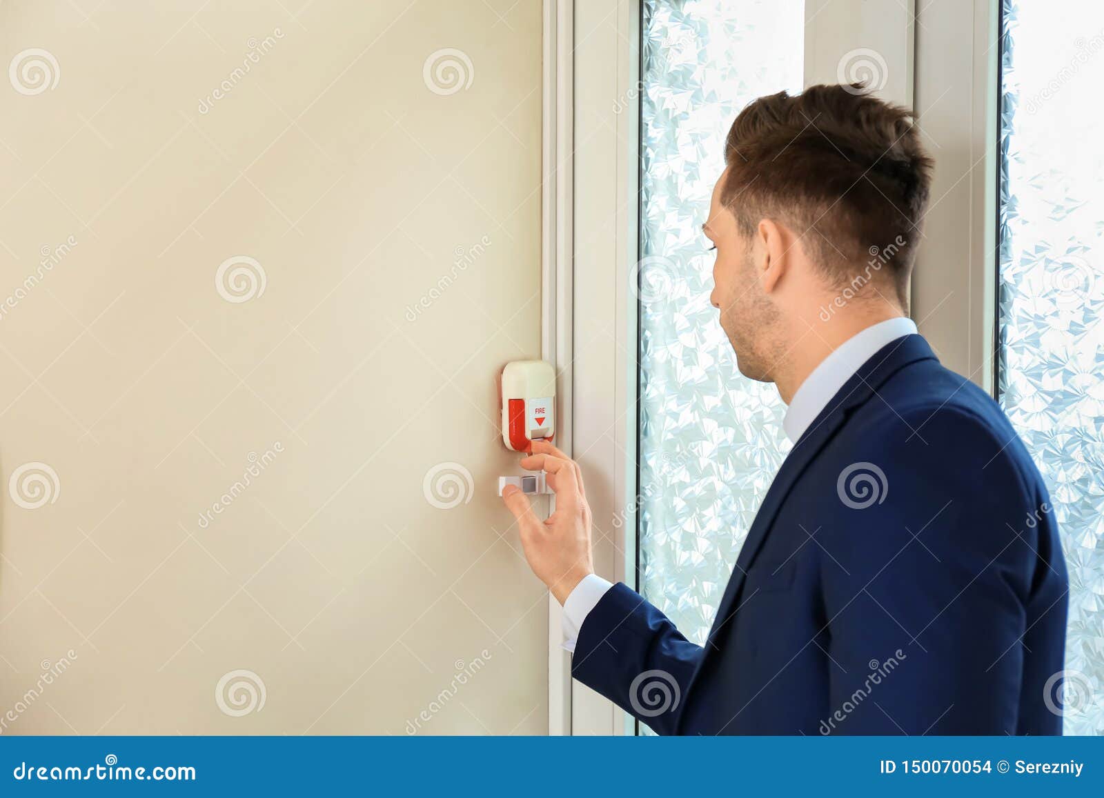 Young Man Using Fire Alarm System Indoors Stock Photo - Image of safe ...