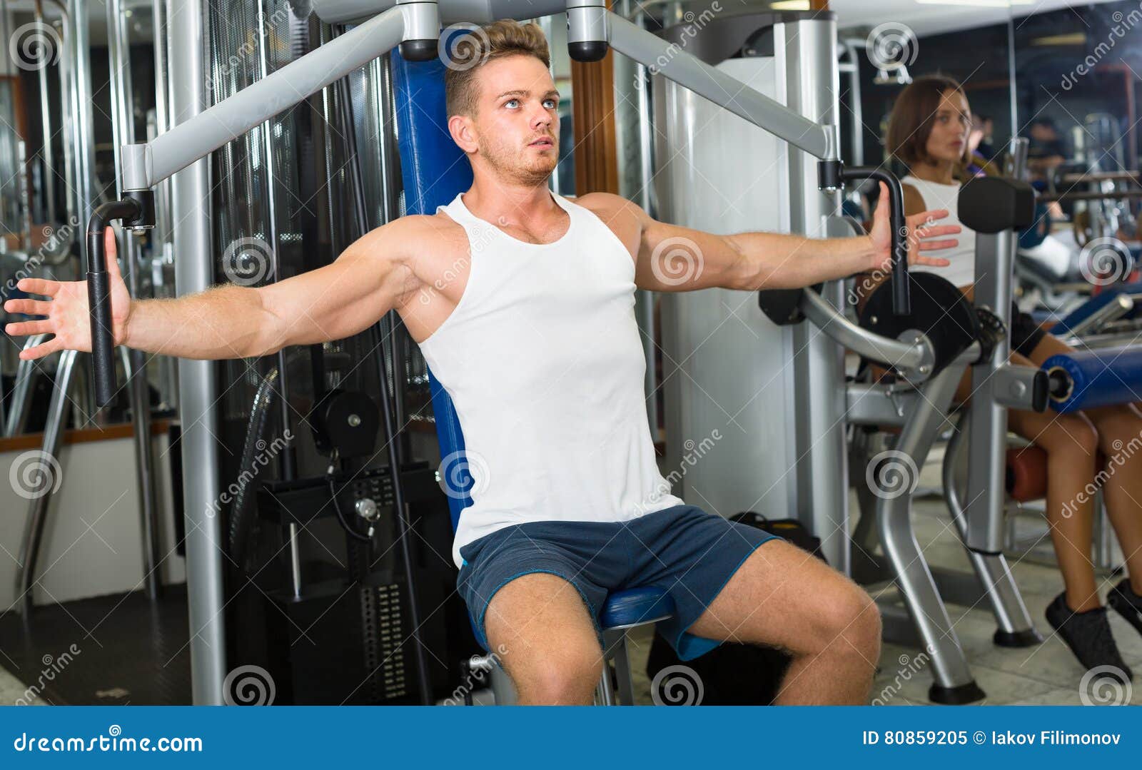 Young Man Using Fly Machine in Gym Stock Image - Image of exercise ...