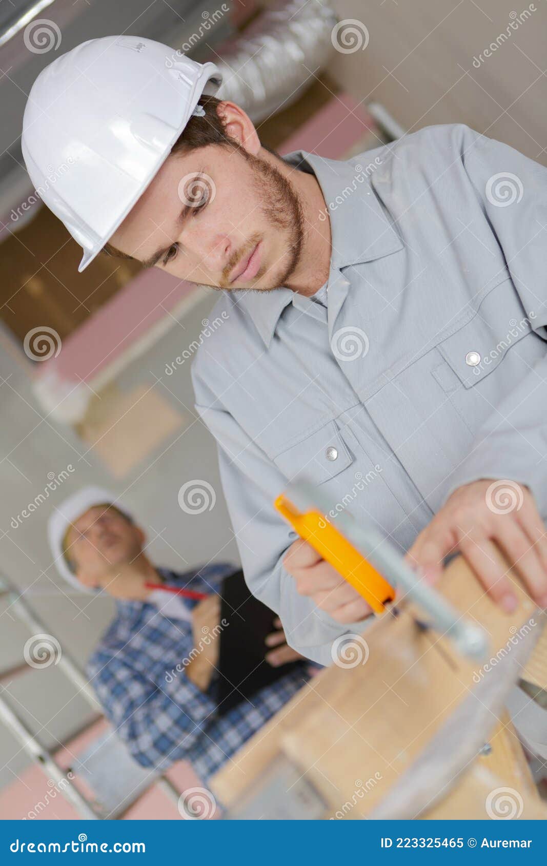Young man using hack saw stock image. Image of tool - 223325465
