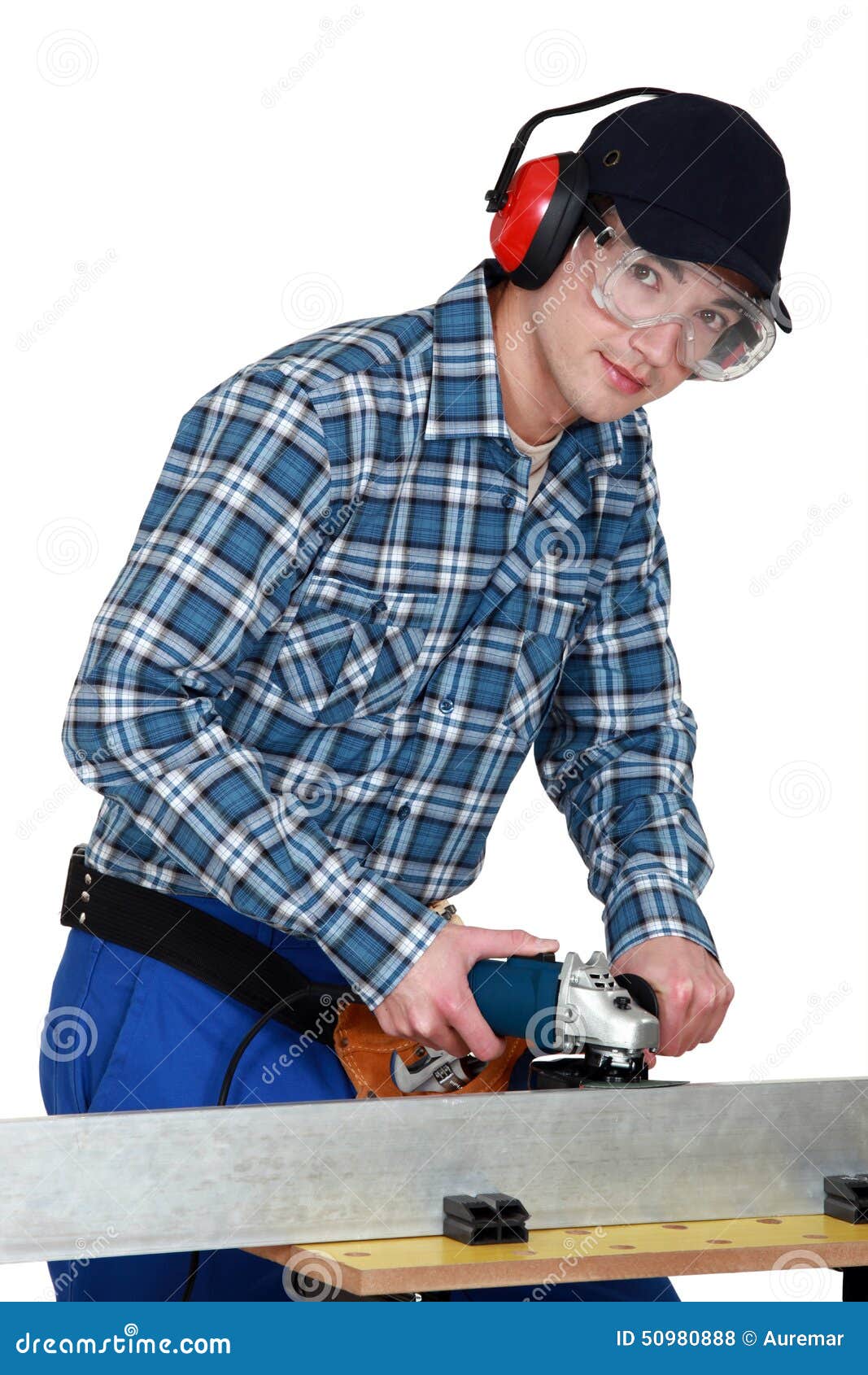 Young man using hacksaw stock photo. Image of goggles - 50980888