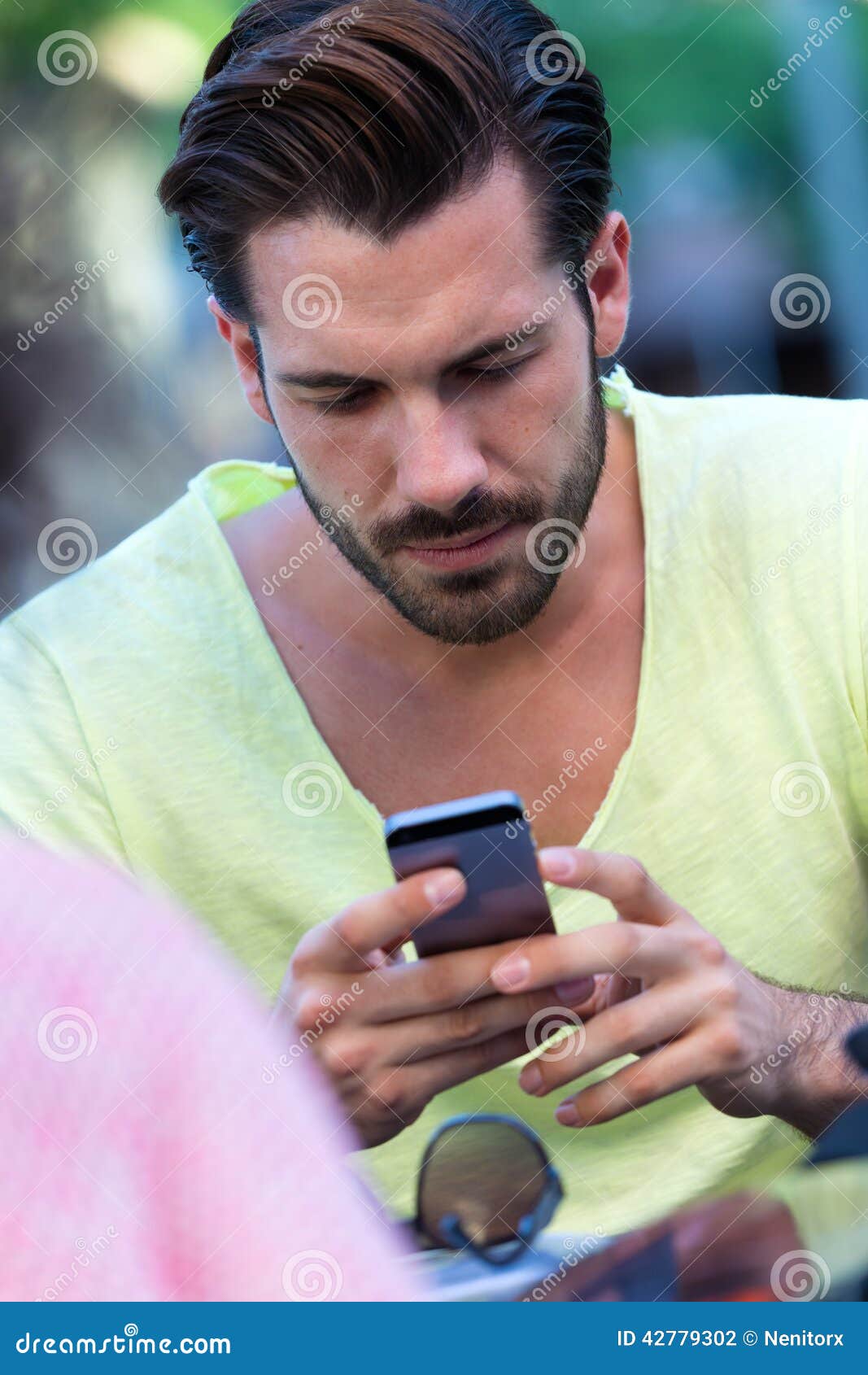 Young Man Using His Mobile Phone in the Street. Stock Photo - Image of ...
