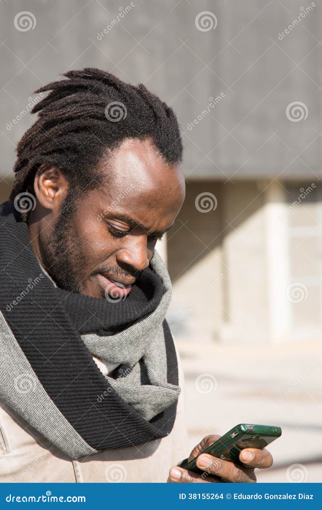 Young man using his phone stock photo. Image of model - 38155264