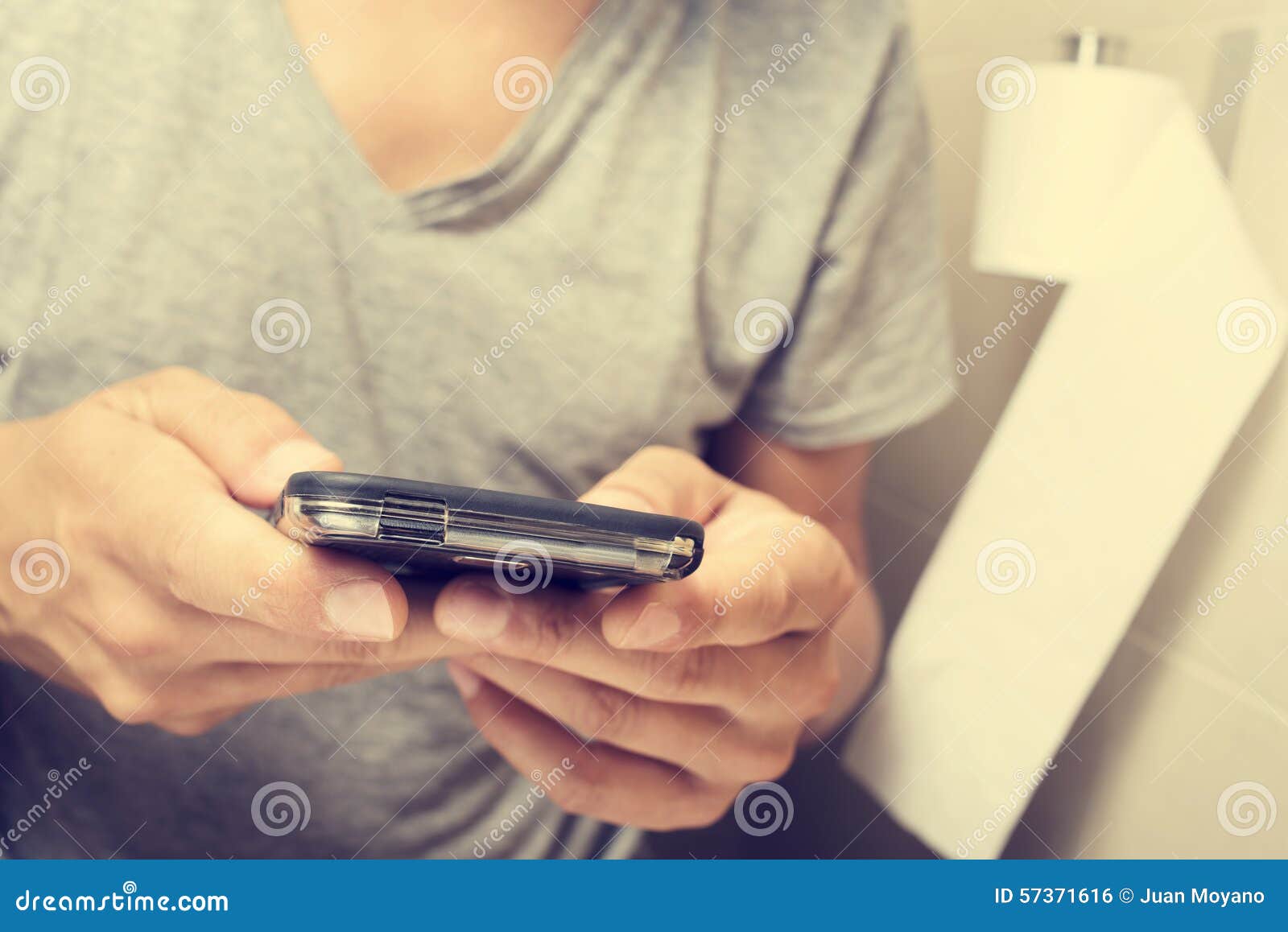 Young Man Using His Smartphone in the Bathroom Stock Photo - Image of ... Young Man Using His Smartphone in the Bathroom Stock Photo - Image of ...