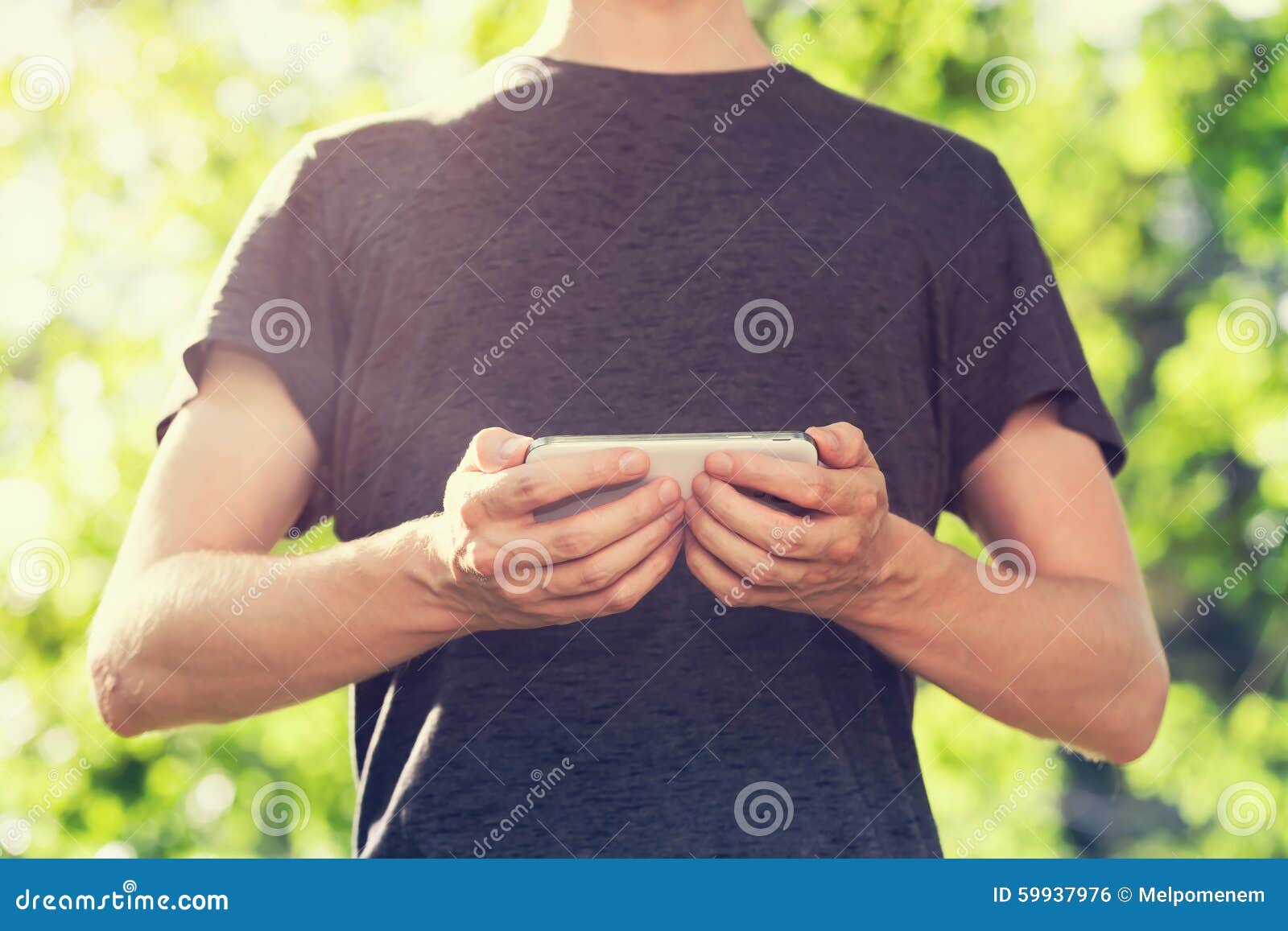 Young Man Using His Smartphone Outside Stock Photo - Image of person ...