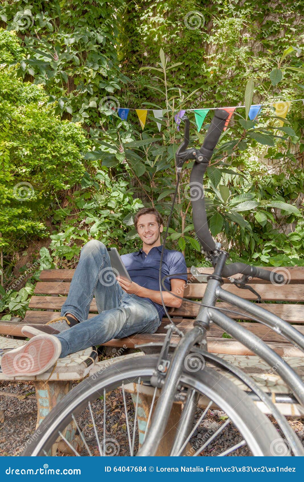 Young man using the ipad stock photo. Image of lifestyle - 64047684