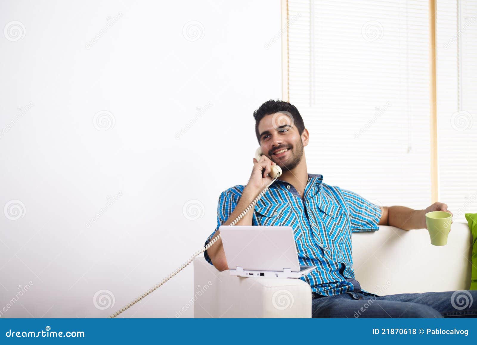 Young man using a laptop stock photo. Image of casual - 21870618