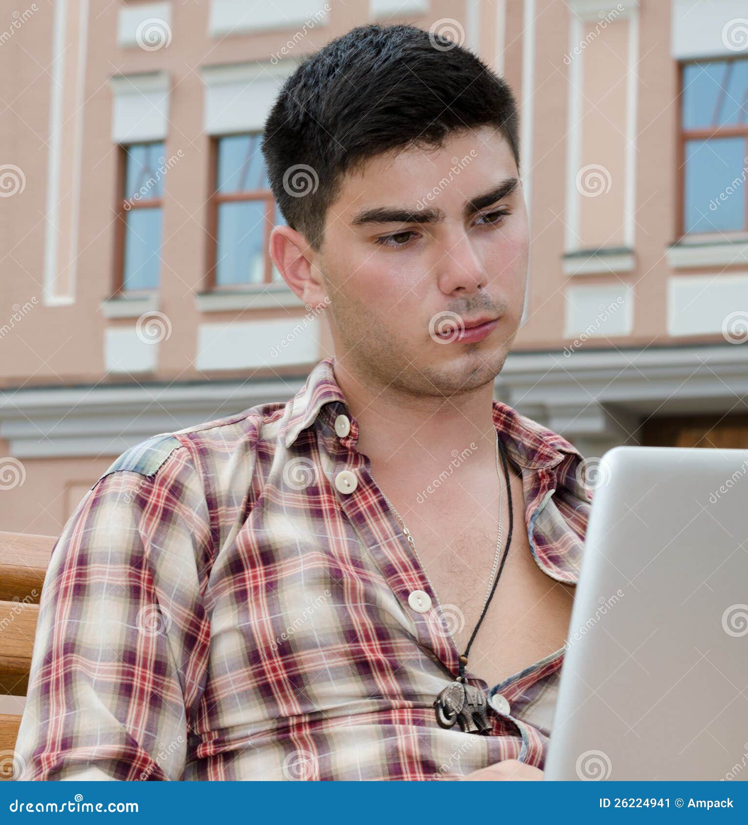 Young man using a laptop stock image. Image of machine - 26224941