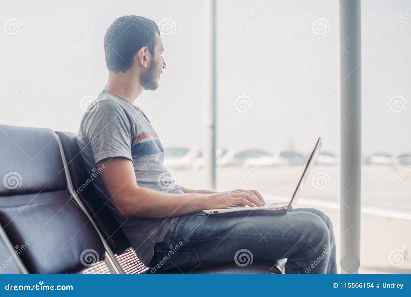 Young Man Using Laptop in Airport Terminal Stock Photo - Image of ...