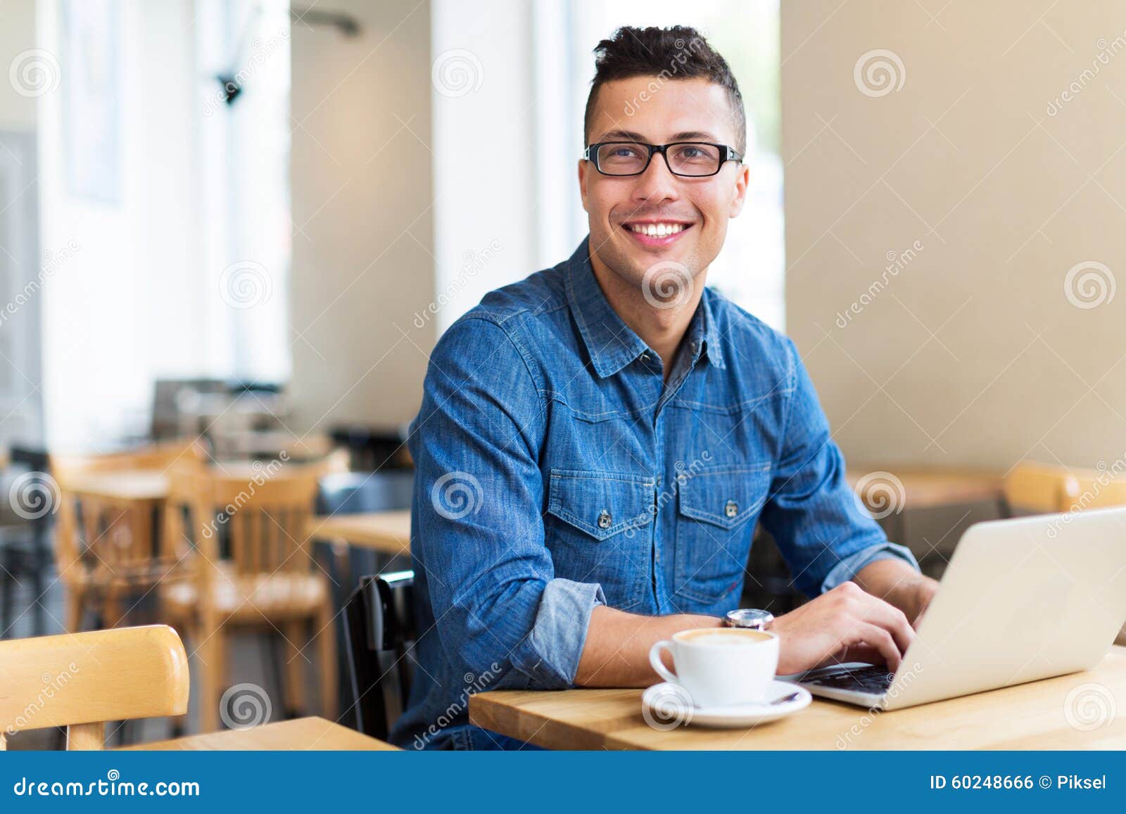 Young Man Using Laptop at Cafe Stock Photo - Image of person, shop ...